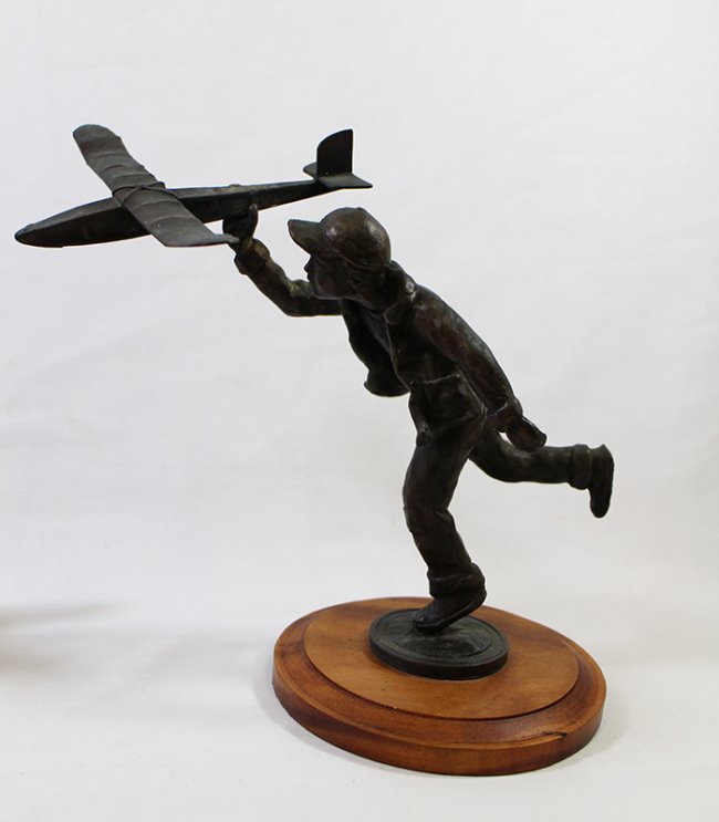 (2) BRONZE BOY W/ PLANE STATUES : Lot 263
