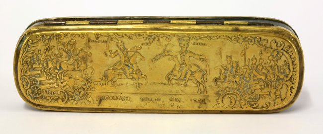 An embossed brass tobacco box, 18th century, the top : Lot 110